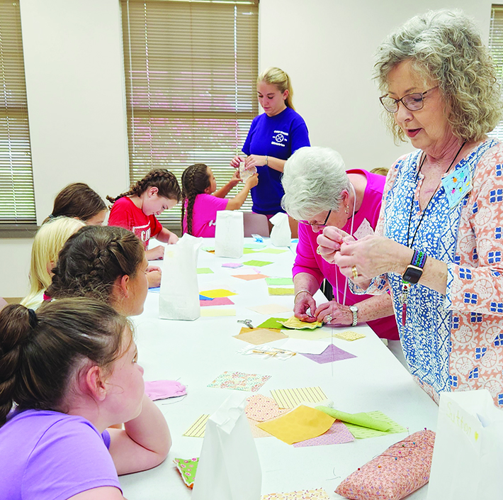 Living History: Senior citizens teach campers how things used to be ...